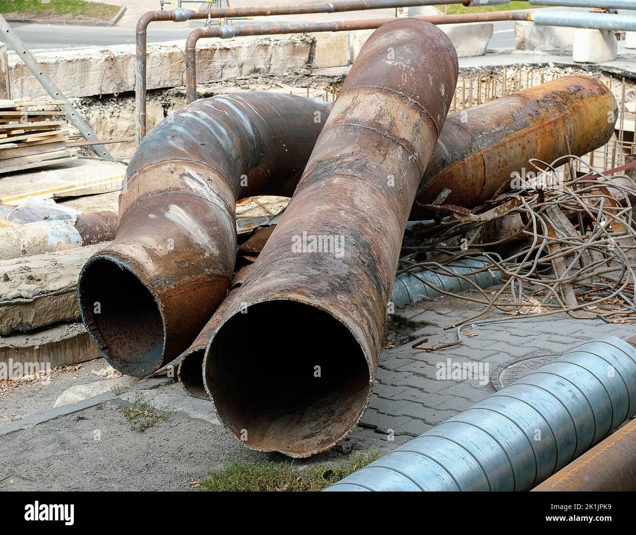 Old rusty metal pipes. Construction work to replace heating pipes ...
