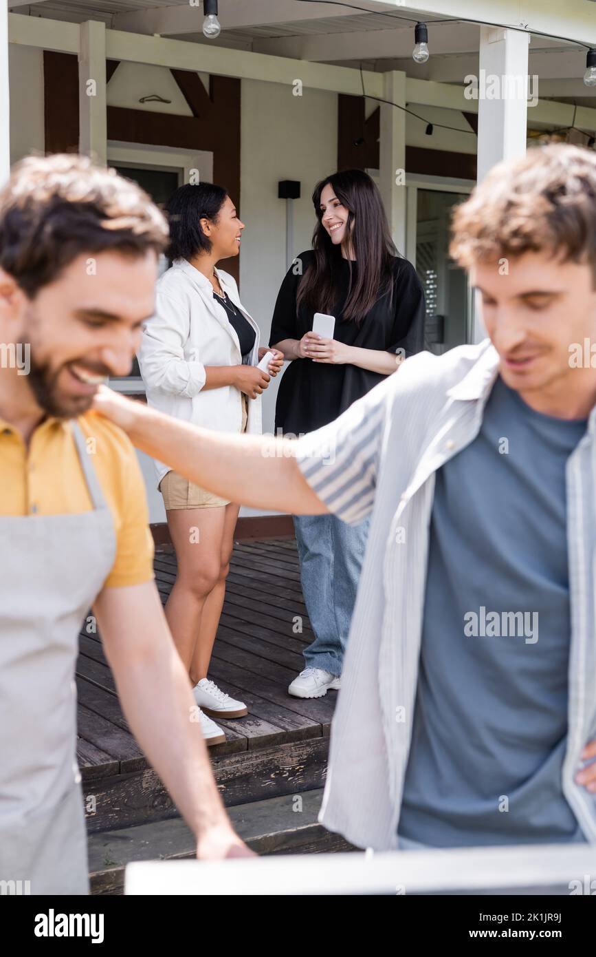 Friends talking to cellphones happy hi-res stock photography and images ...