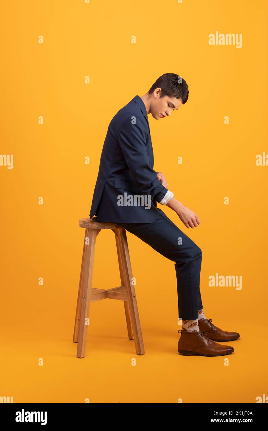 Man on stool hi-res stock photography and images - Alamy