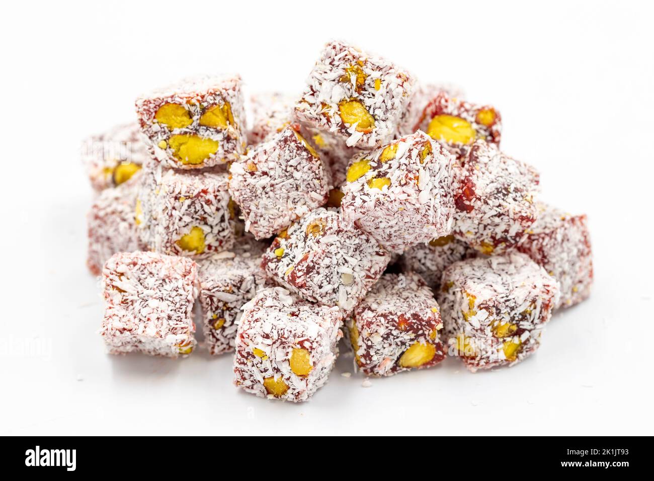 Turkish delight. Turkish delight with pistachio and coconut isolated on a white background ...