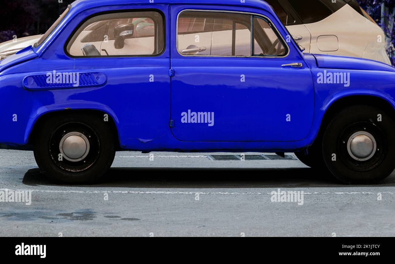 old blue car parked in the streets. vintage auto Stock Photo - Alamy