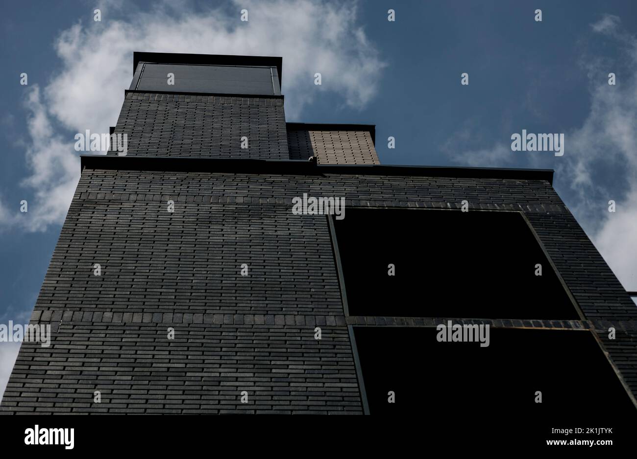 Brick Commercial Building. black brick architecture Stock Photo - Alamy
