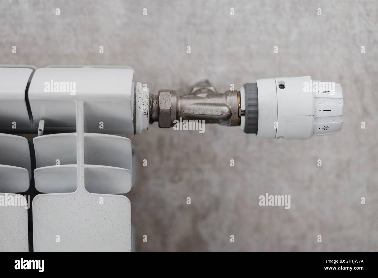 Heating metal radiator with adjuster of warming Stock Photo - Alamy