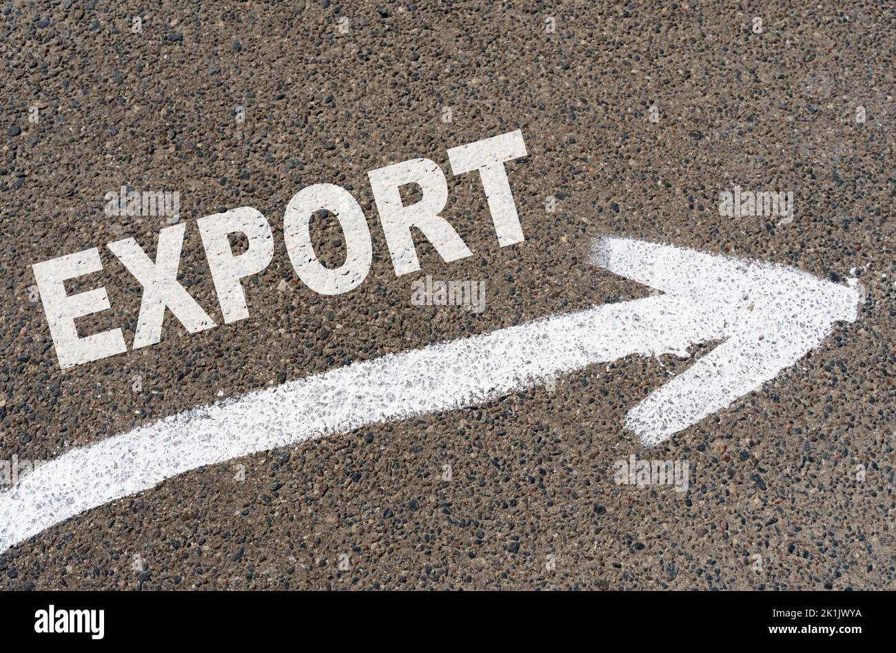 Business concept. On the asphalt road markings an arrow with the ...