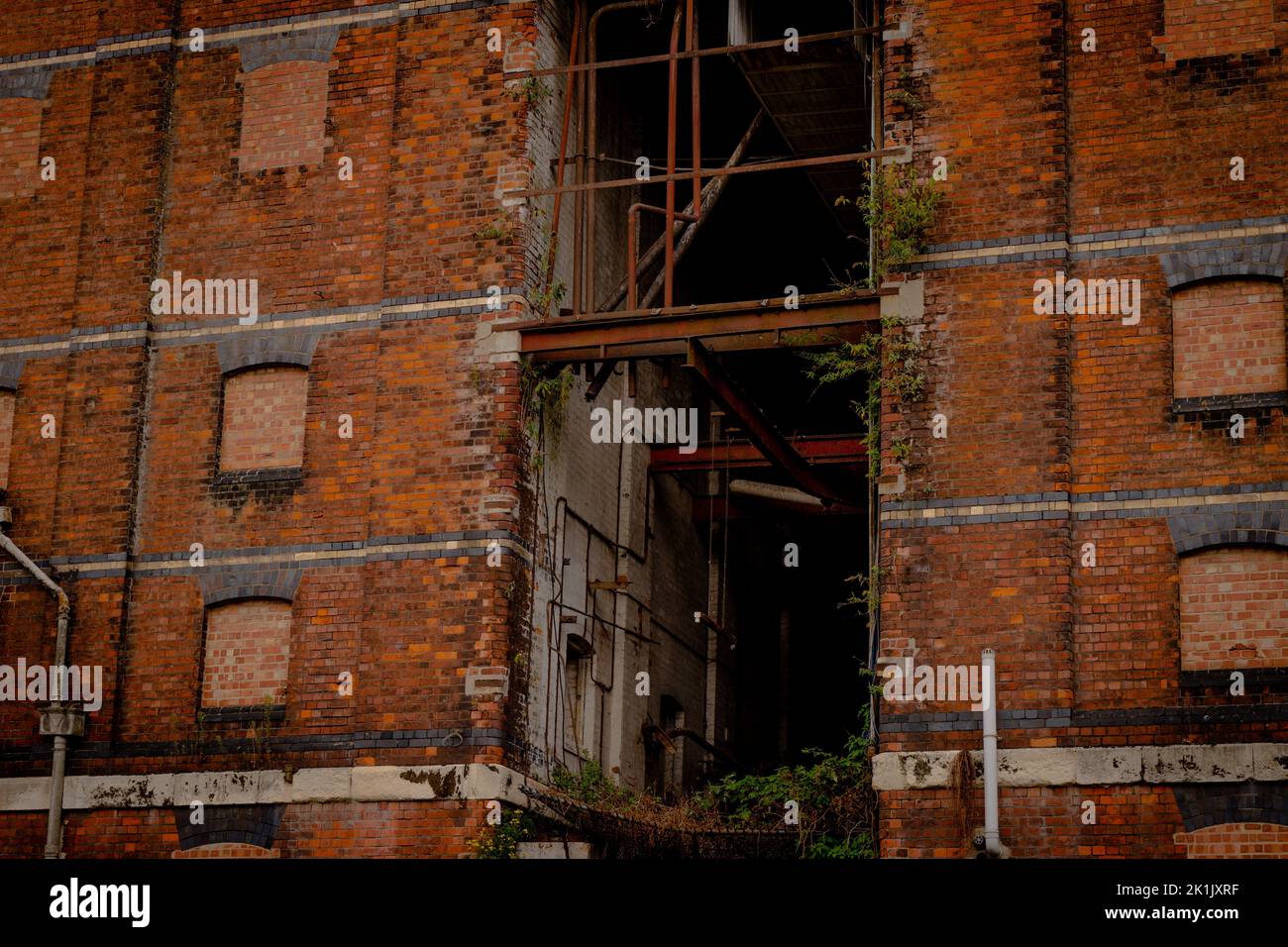 An old abandoned red brick building in Gloucester docks, United Kingdom ...