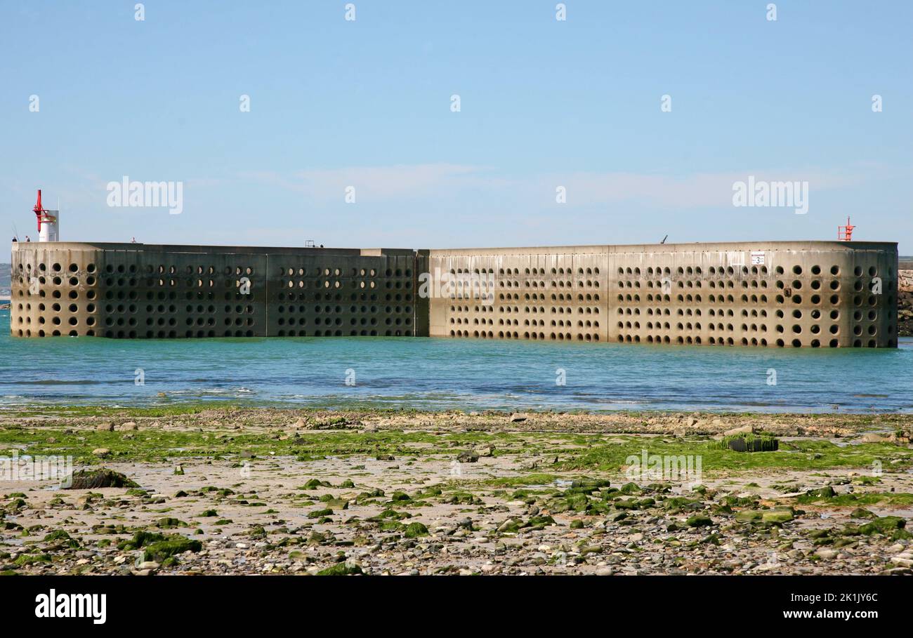 The harbour wall at the Port of Dielette on the Cherbourg Peninsula ...