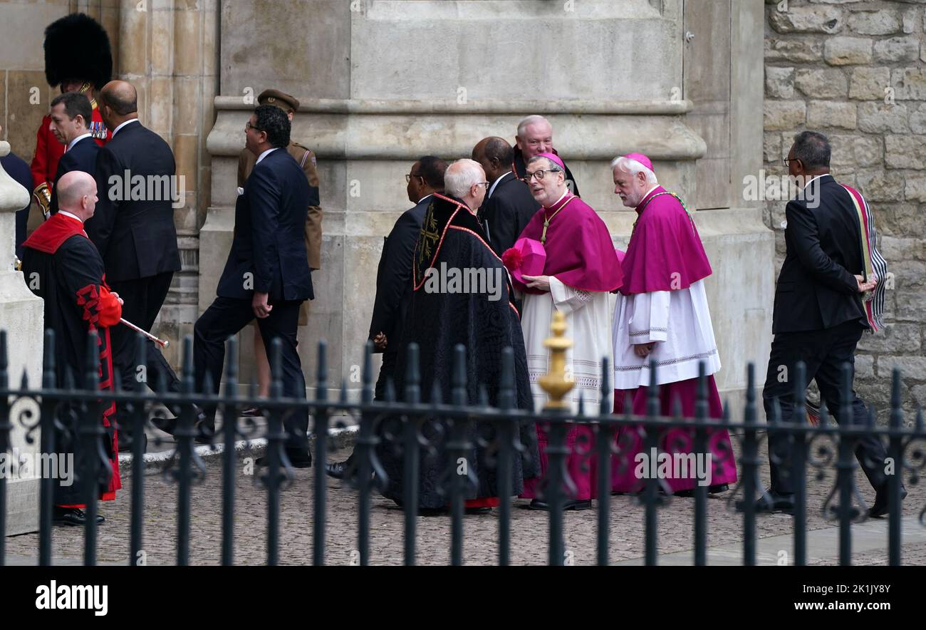 The Dean of Westminster David Hoyle greets guests and members of the ...
