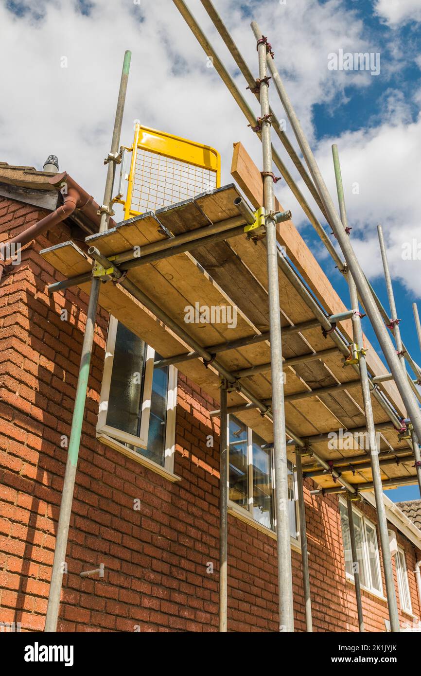 Scaffolding poles on a domestic property Stock Photo - Alamy