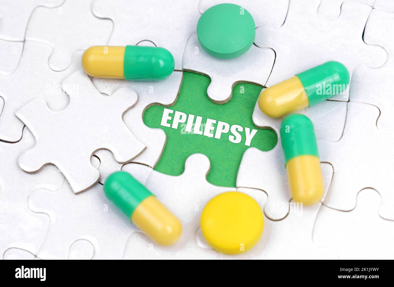 Medicine concept. There are pills and vitamins on the white puzzles ...