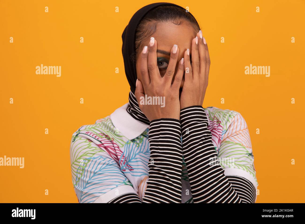 Muslim woman hiding face hands hi-res stock photography and images - Alamy