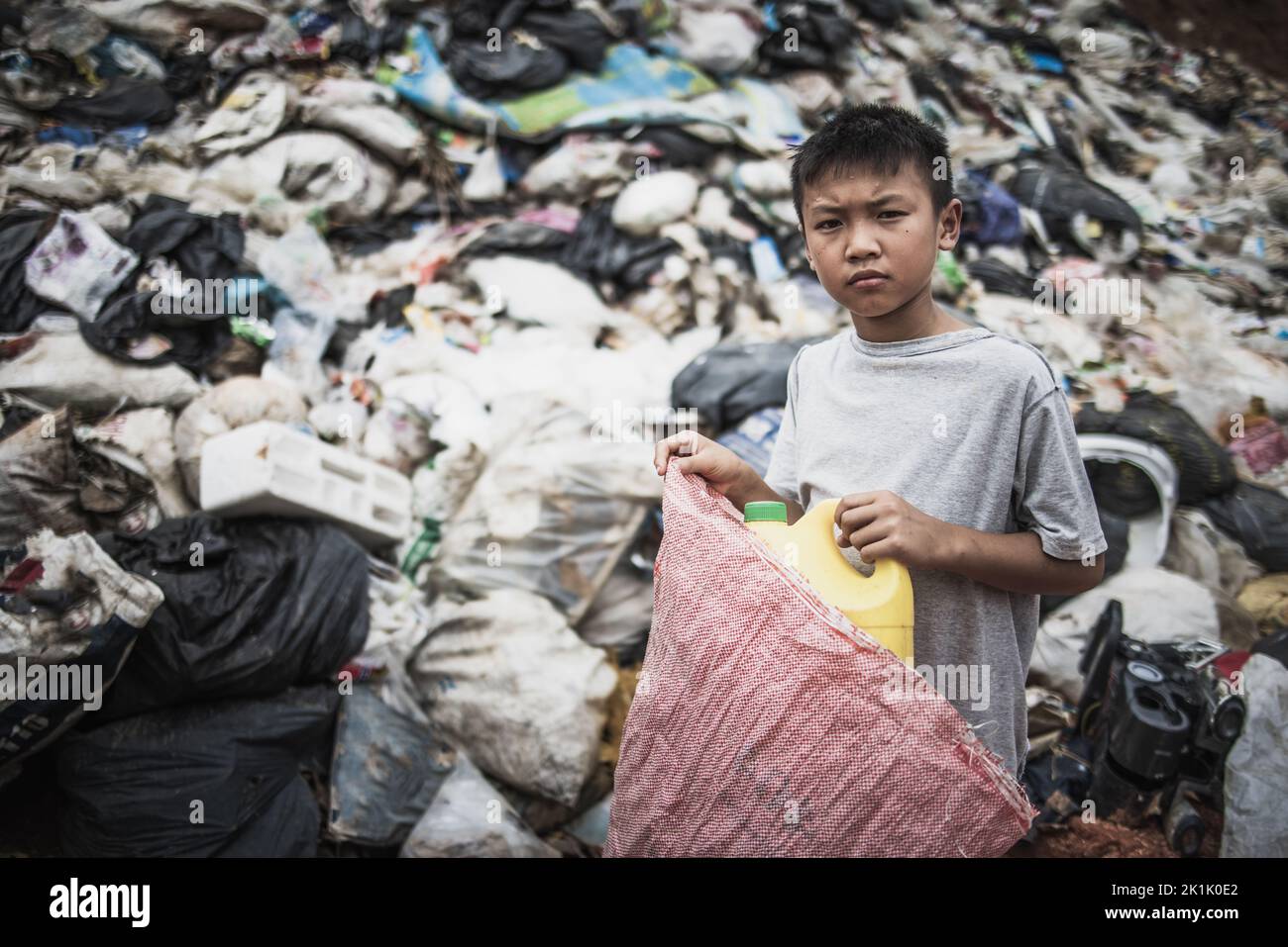 Child labor. Children are forced to work on rubbish. Poor children ...