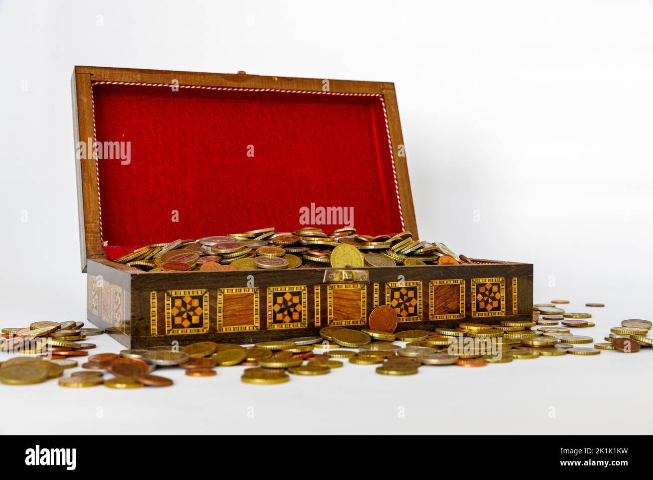 A treasure chest full of coin Stock Photo - Alamy
