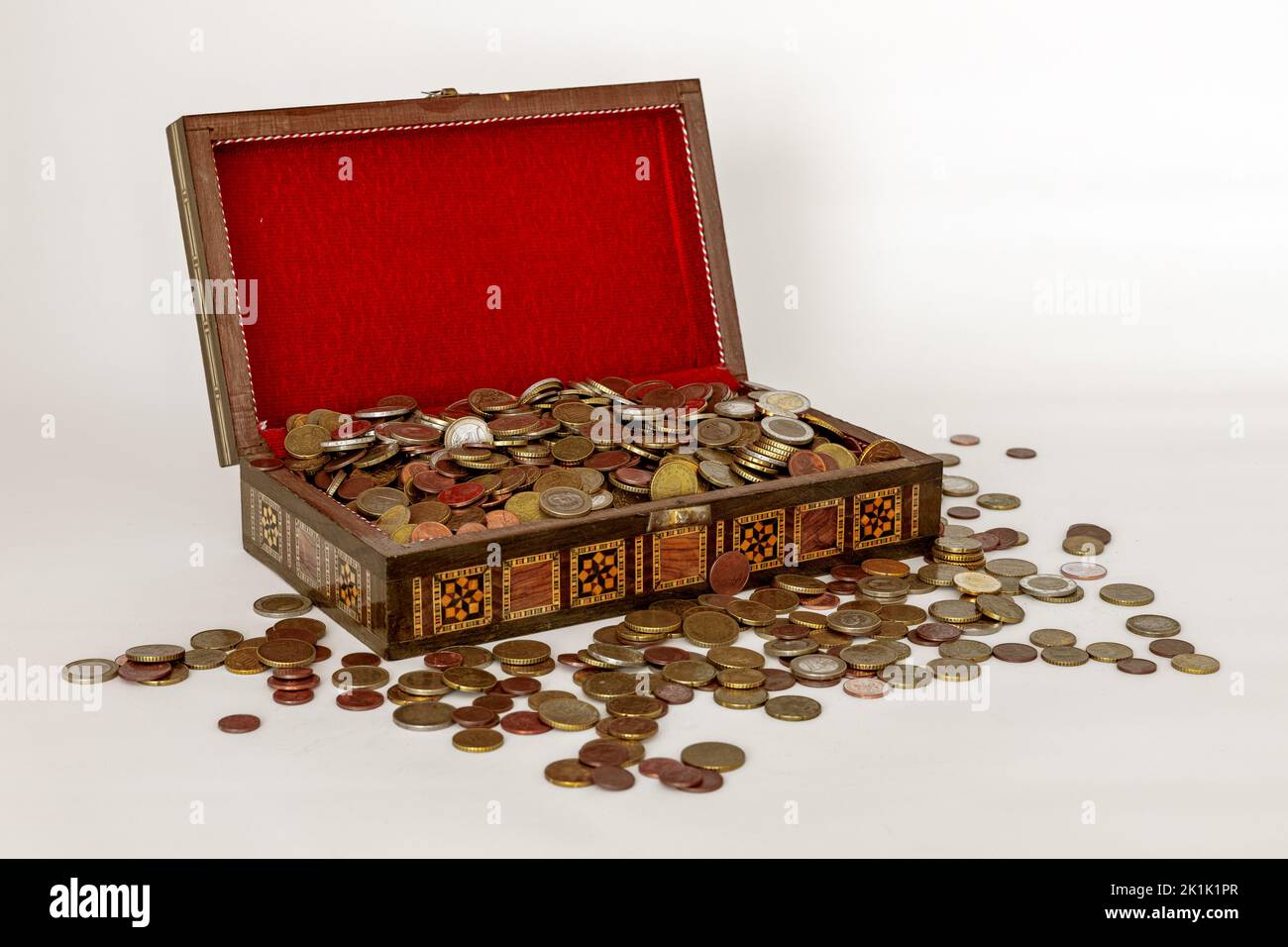 A treasure chest full of coin Stock Photo - Alamy