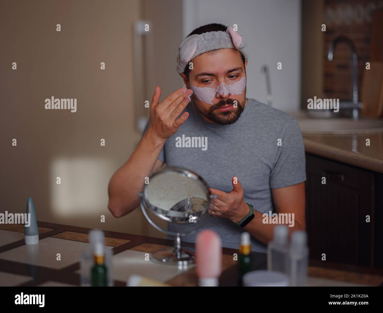 Men's beauty concept. caucAsian guy checking his skin. man looking into ...