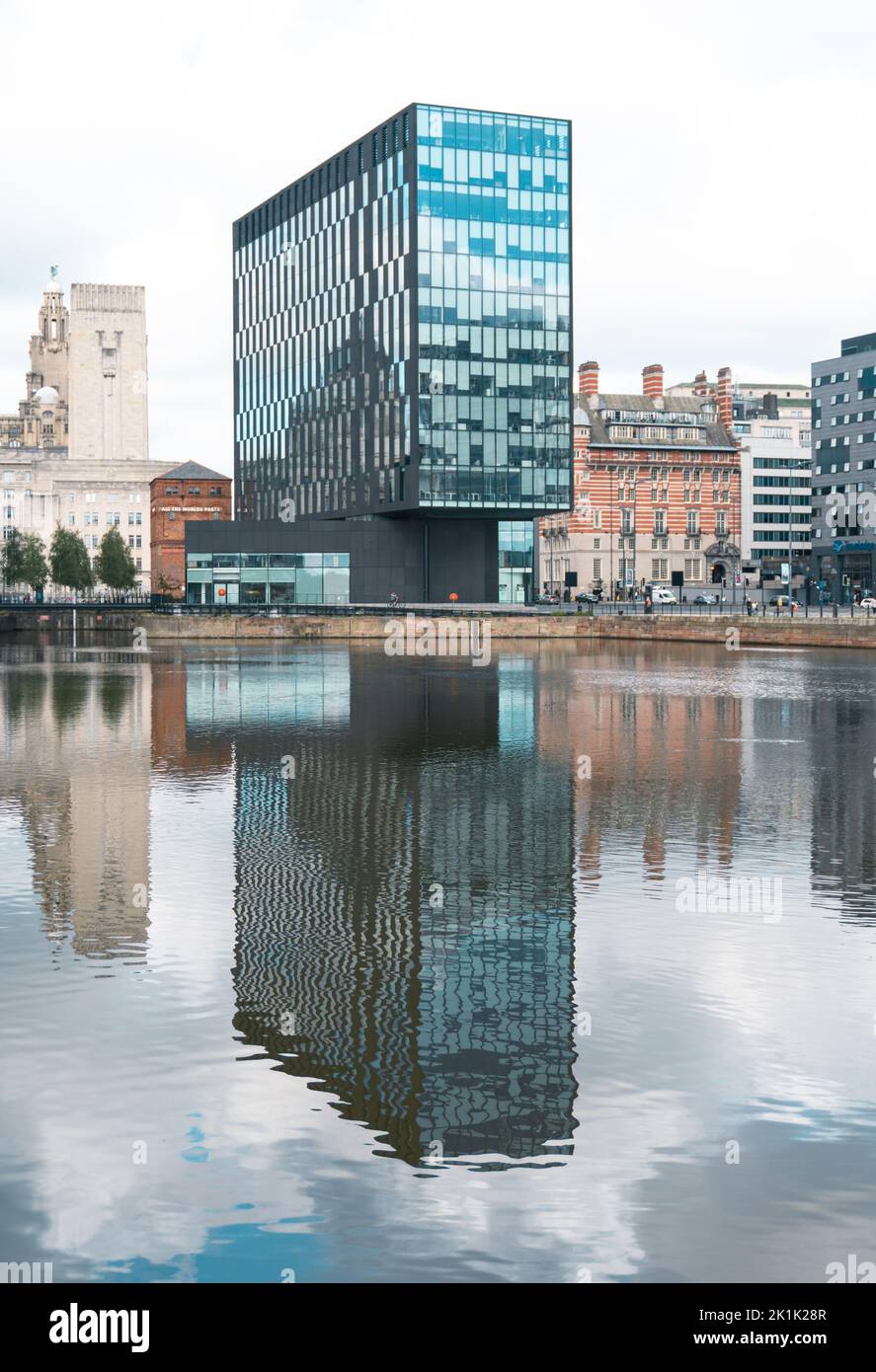 A vertical shot of a huge modern building in the city of Liverpool with ...