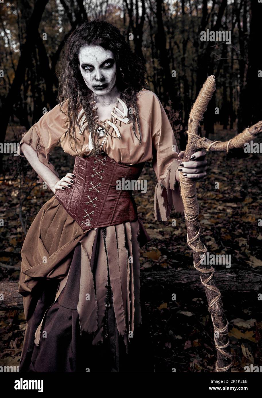 Halloween (Samhain) theme: awful gloomy voodoo witch with stick ...