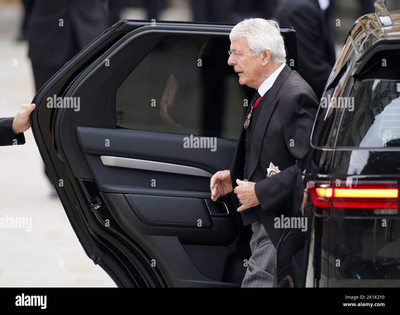 Former Prime Minister John Major arrives for the State Funeral of Queen Elizabeth II, held at ...