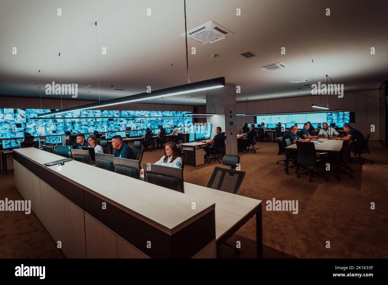 Group of Security data center operators working in a CCTV monitoring ...