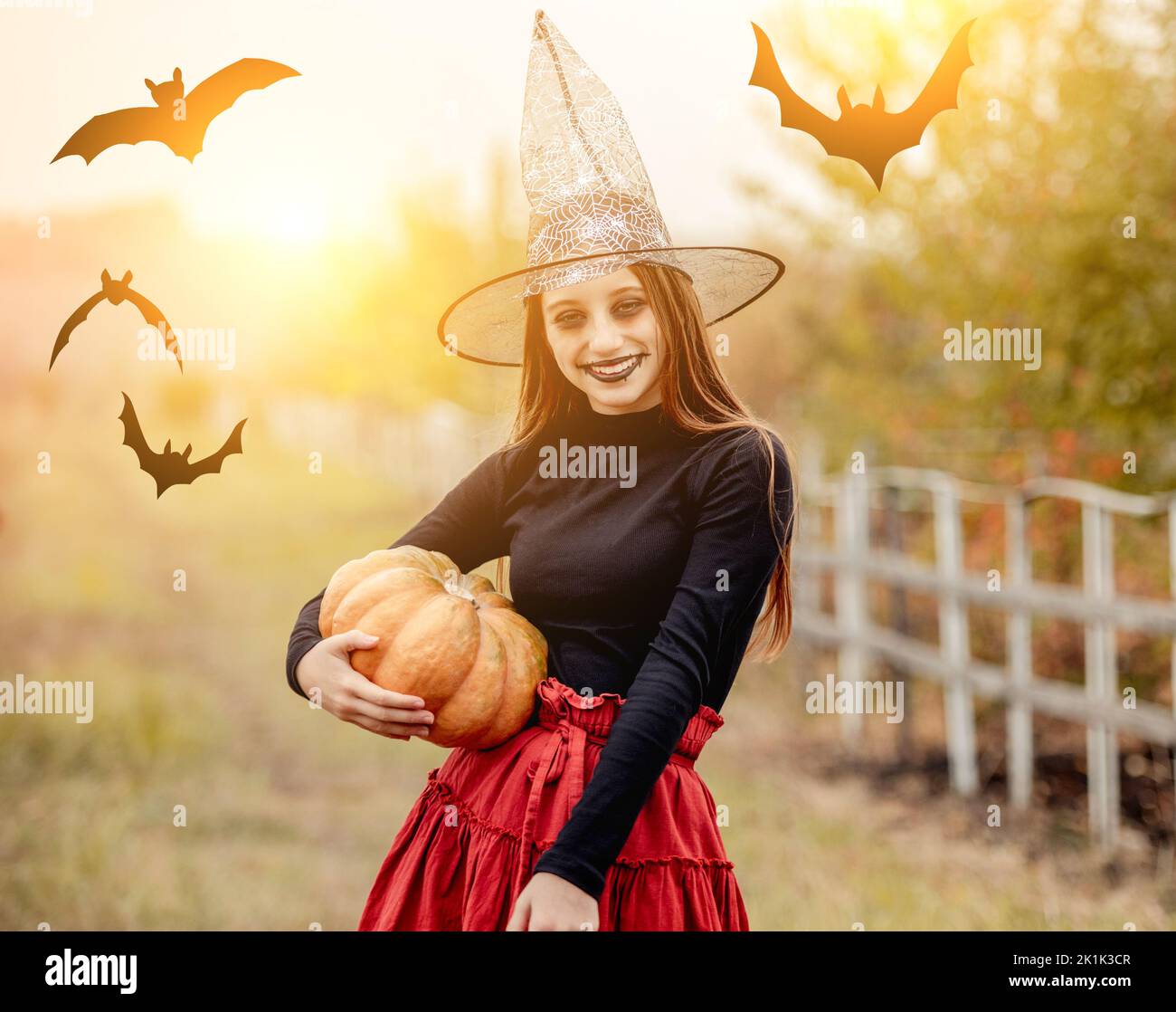 Portrait of teenage girl in witch hat Stock Photo - Alamy