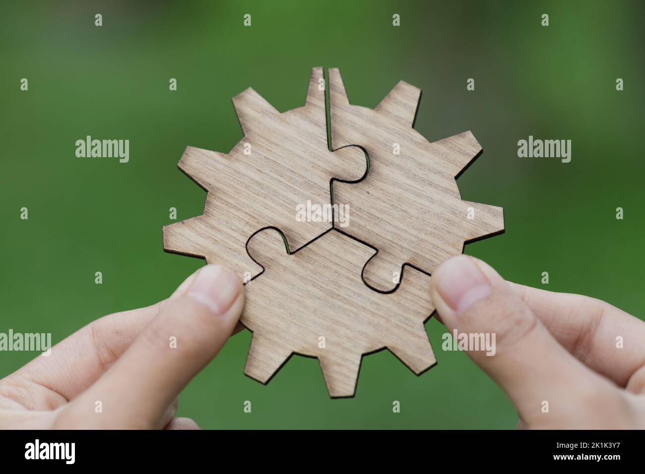 Closeup hand of man connecting jigsaw puzzle with sunlight effect ...