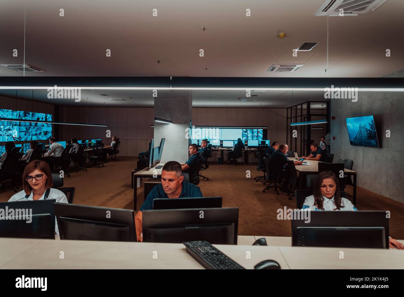Group of Security data center operators working in a CCTV monitoring ...