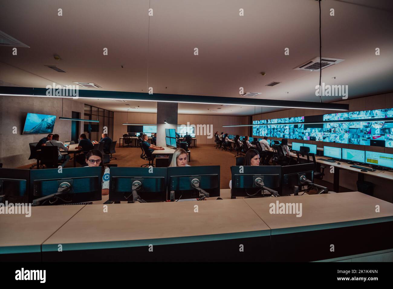 Group of Security data center operators working in a CCTV monitoring ...
