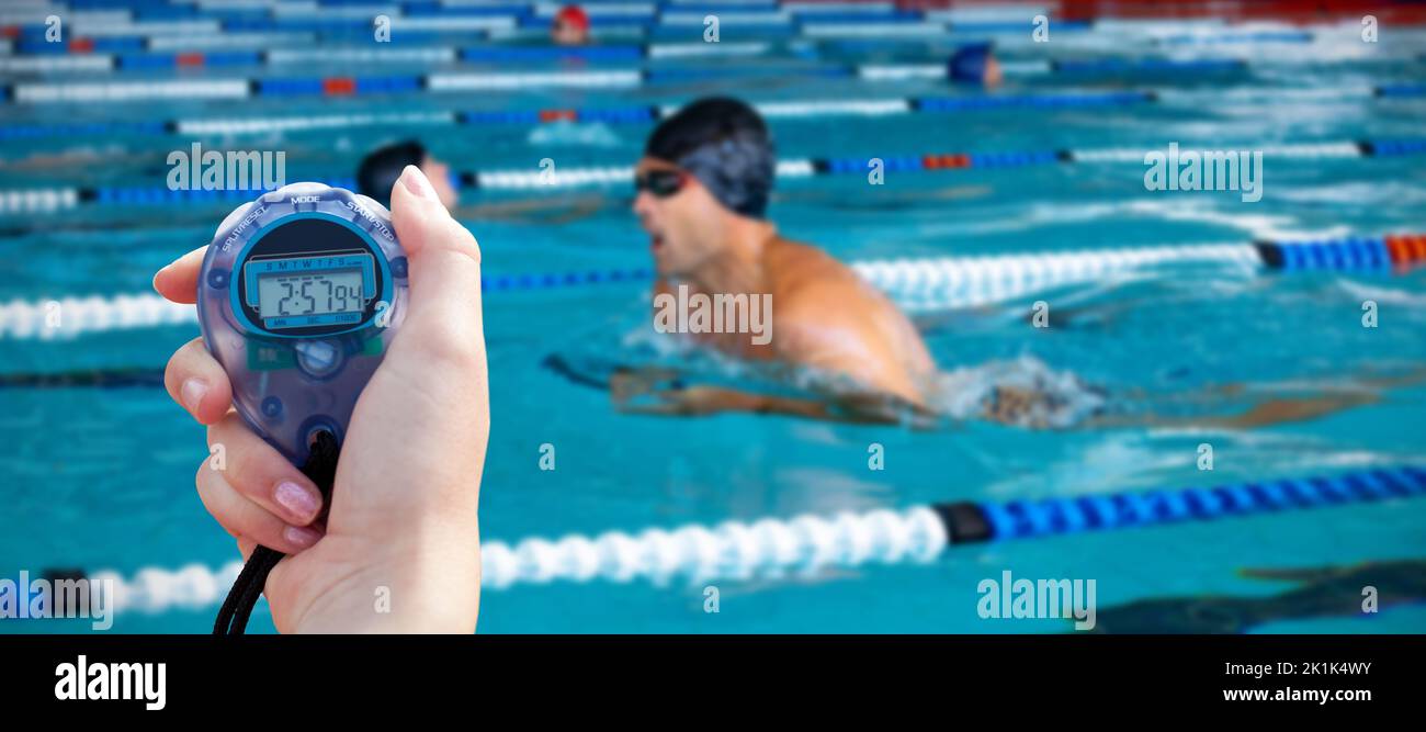 Close-up of a woman holding a chronometer to measure performance ...