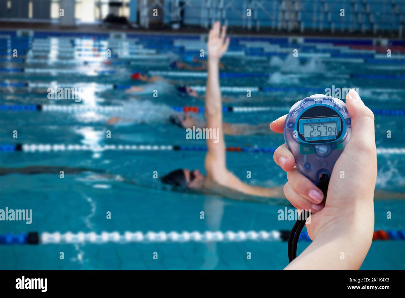 Close-up of a woman holding a chronometer to measure performance ...