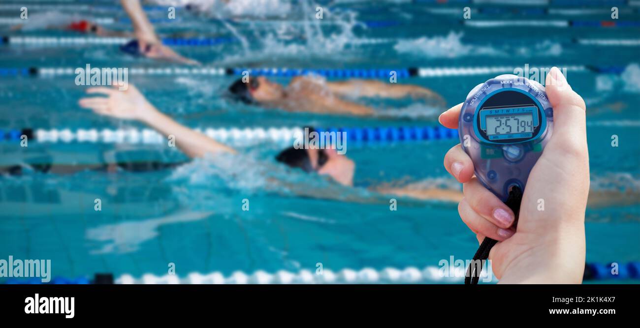 Close-up of a woman holding a chronometer to measure performance ...
