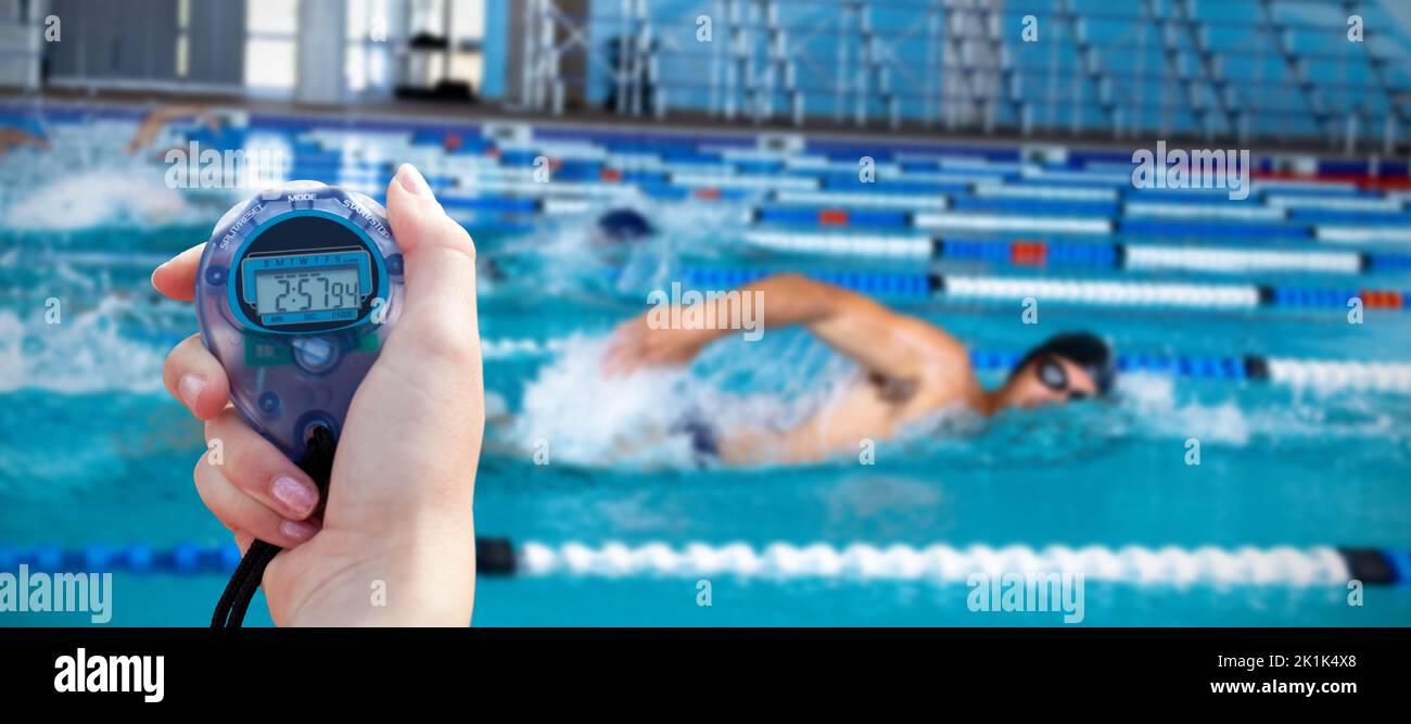 Close-up of a woman holding a chronometer to measure performance ...