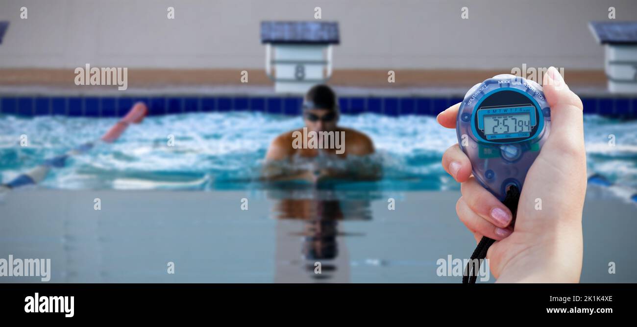 Close-up of a woman holding a chronometer to measure performance ...