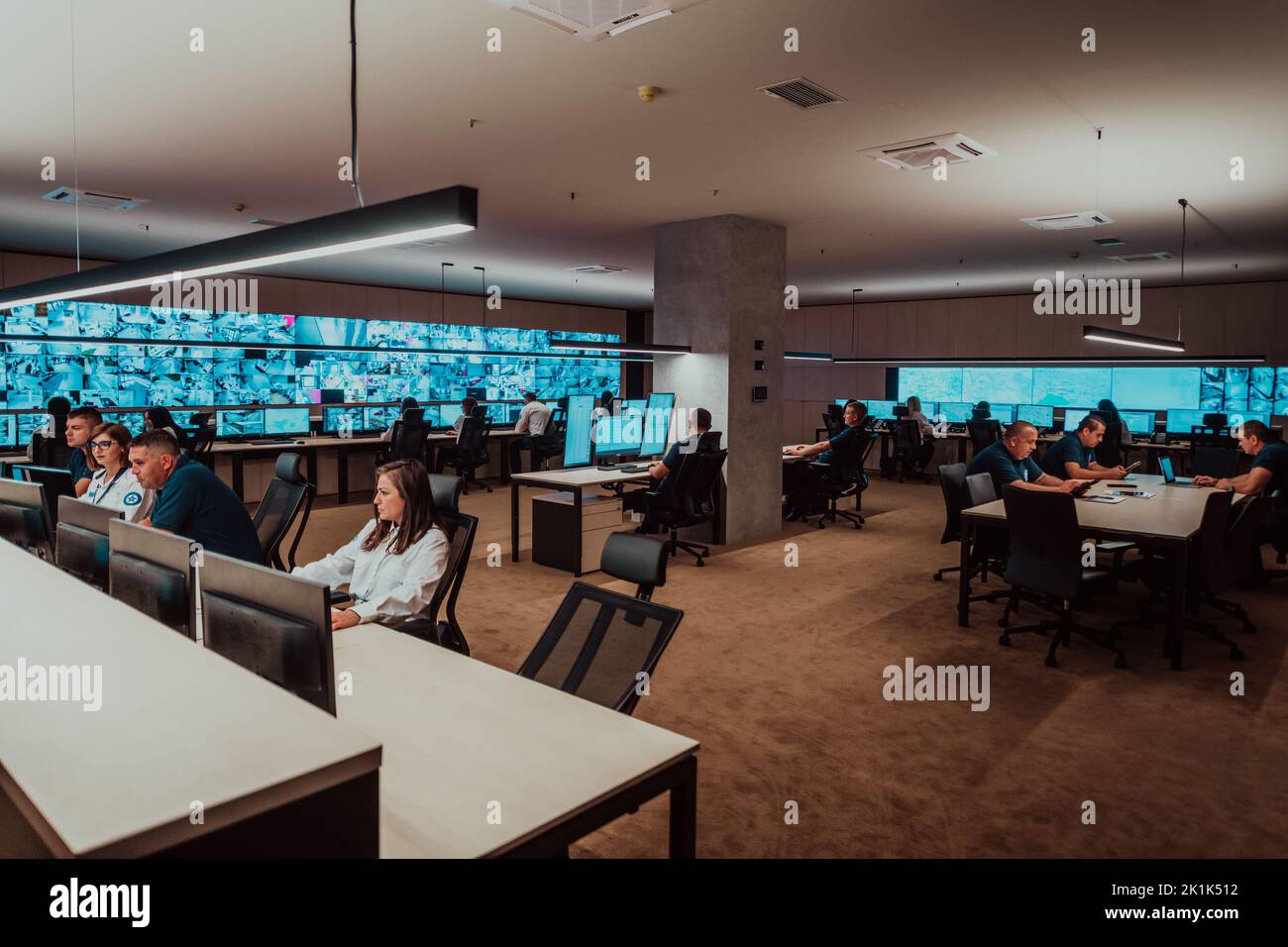 Group of Security data center operators working in a CCTV monitoring ...