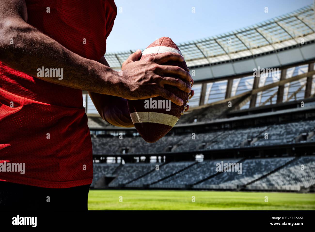 American Football Player against rugby goal post on a sunny day in the ...
