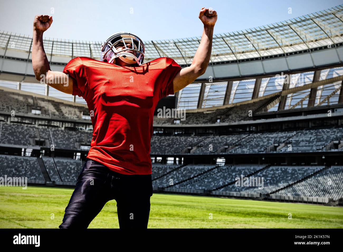 American Football Player against rugby goal post on a sunny day in the ...