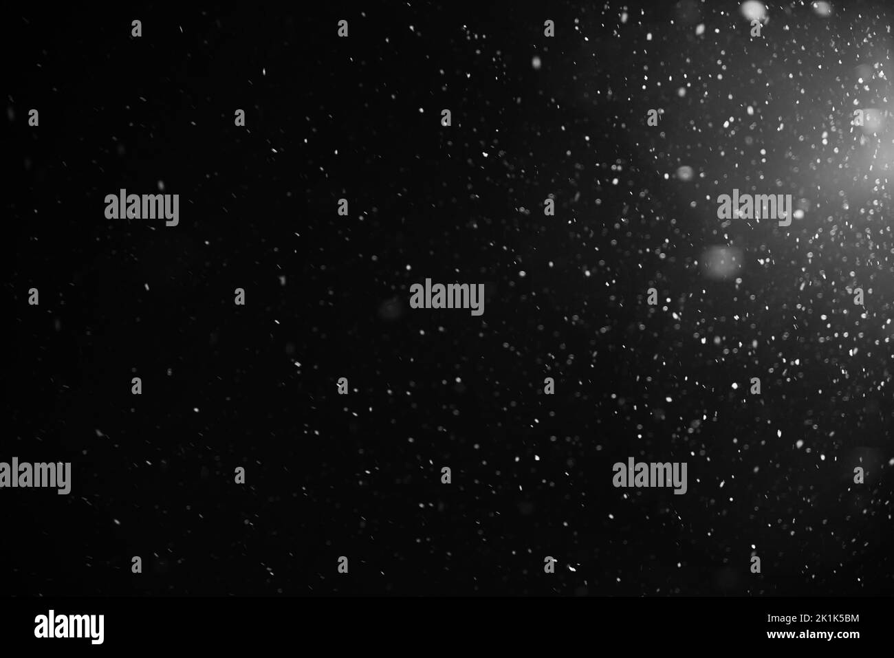 Snowflakes falling down on black background, heavy snow flakes isolated ...