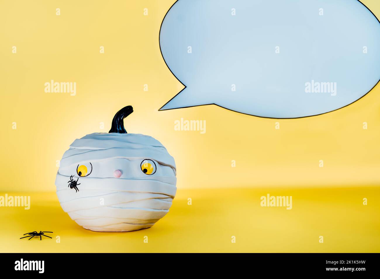 Funny and cute pumpkin mummy with spider and speech bubble with copy ...