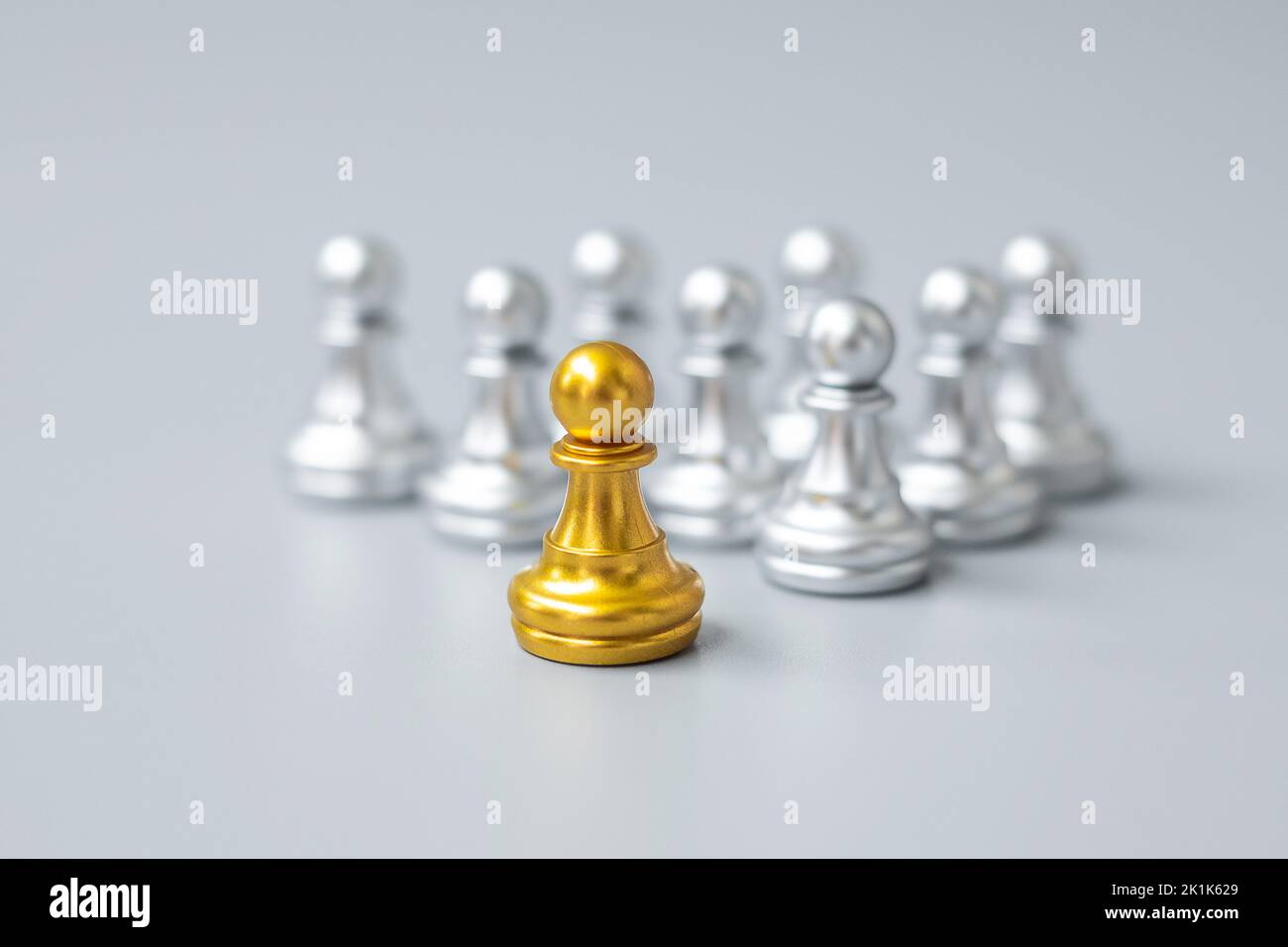 golden chess pawn pieces or leader businessman stand out of crowd ...