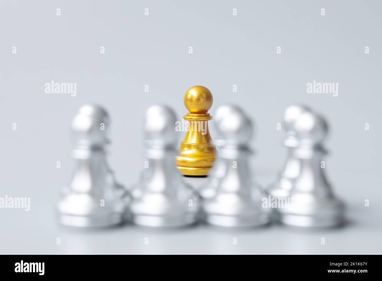golden chess pawn pieces or leader businessman stand out of crowd ...