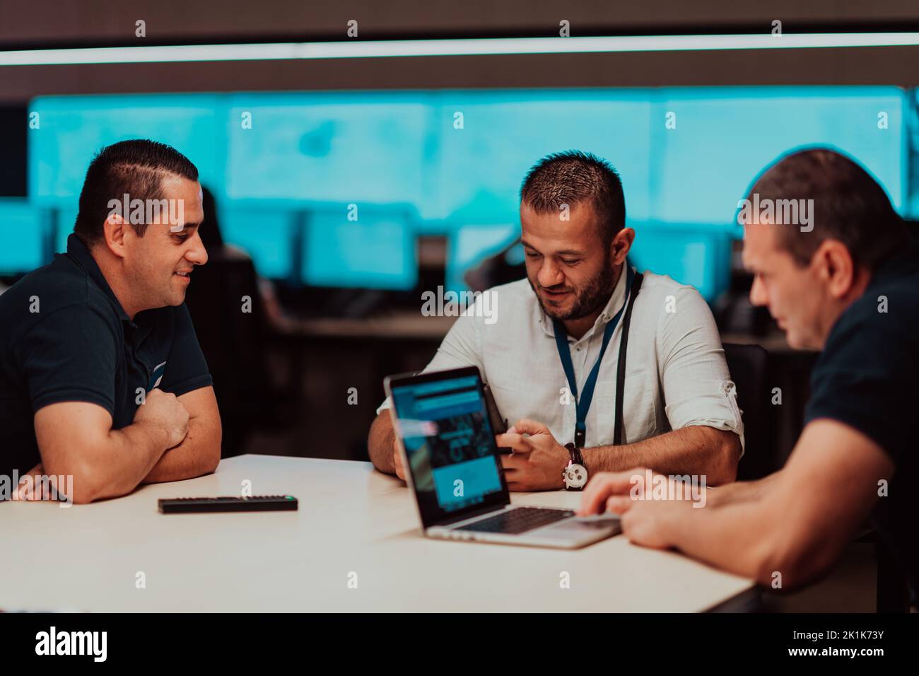 Group of Security data center operators working in a CCTV monitoring ...