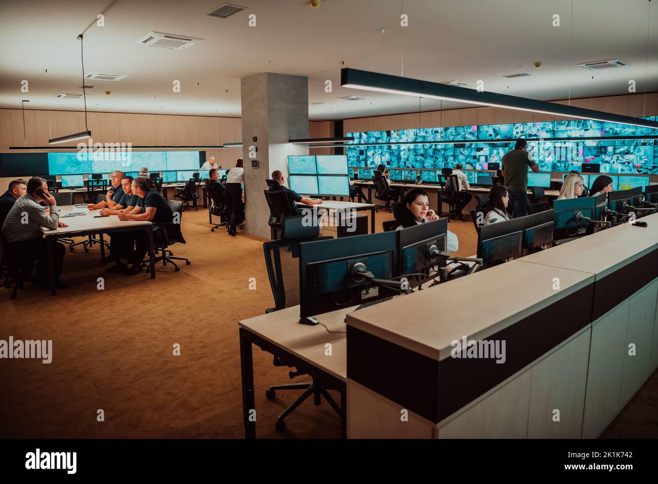 Group of Security data center operators working in a CCTV monitoring ...