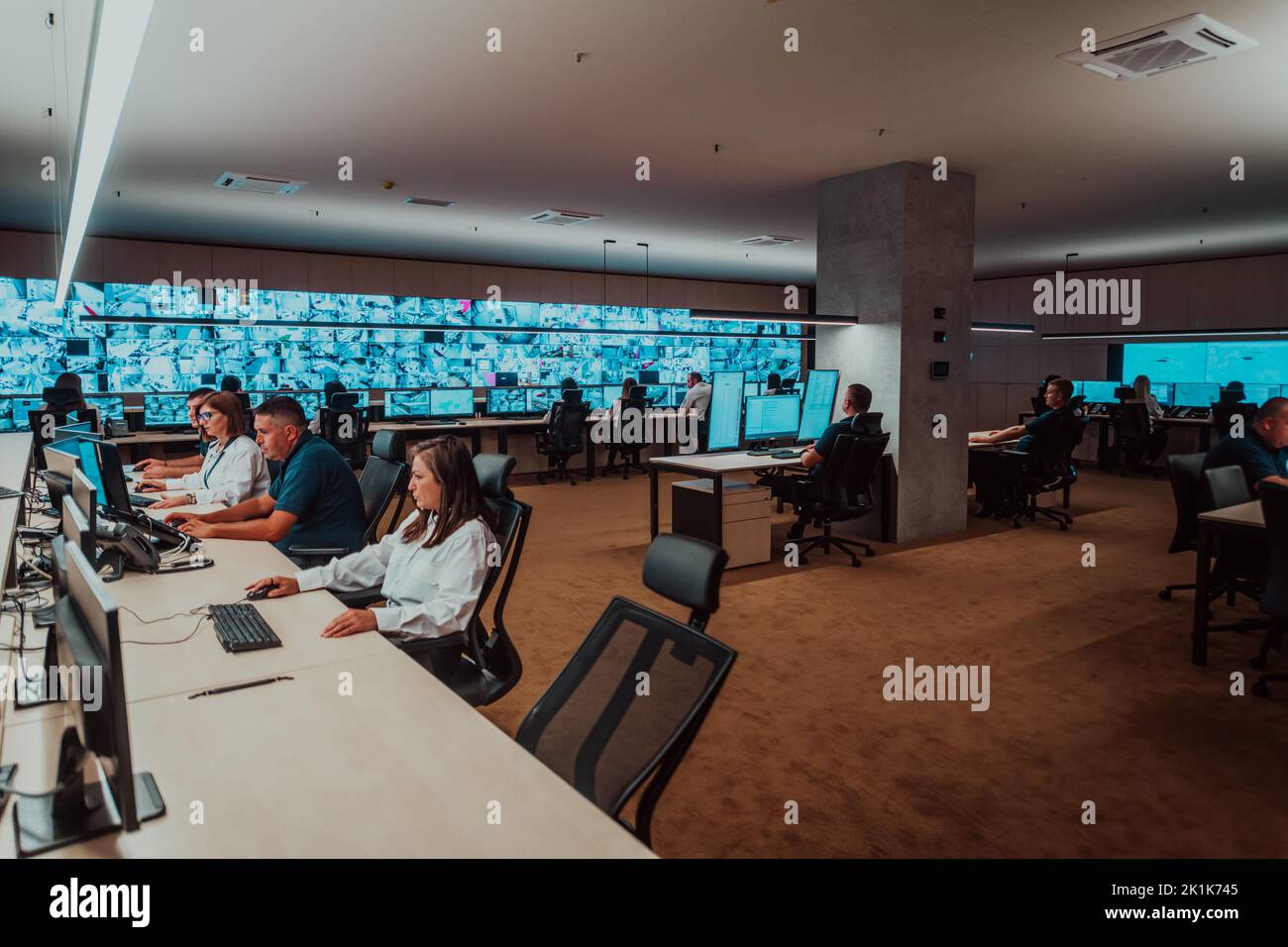 Group of Security data center operators working in a CCTV monitoring ...