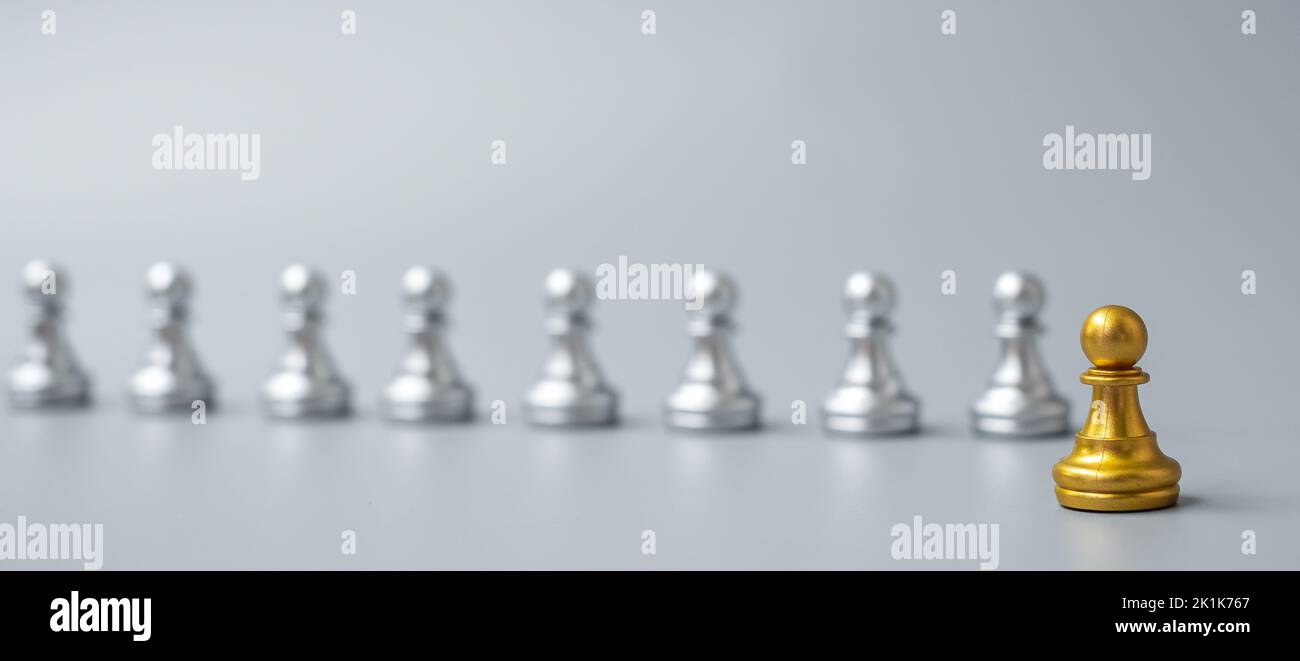 Gold Chess Pawn figure Stand out from the crowd on Chessboard ...