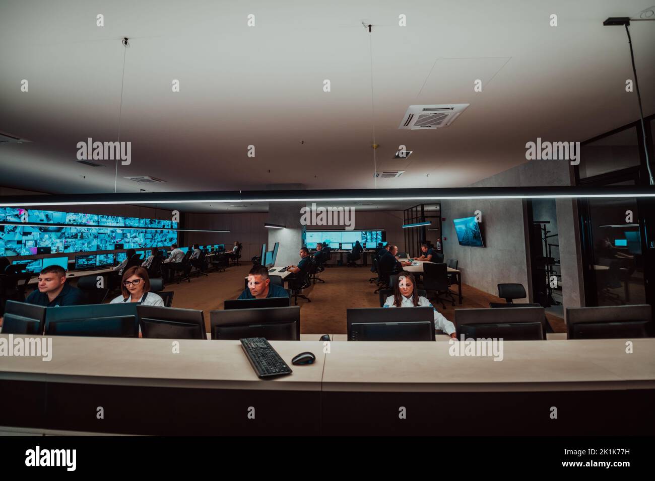 Group of Security data center operators working in a CCTV monitoring ...