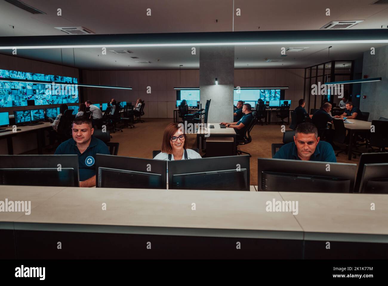 Group of Security data center operators working in a CCTV monitoring ...
