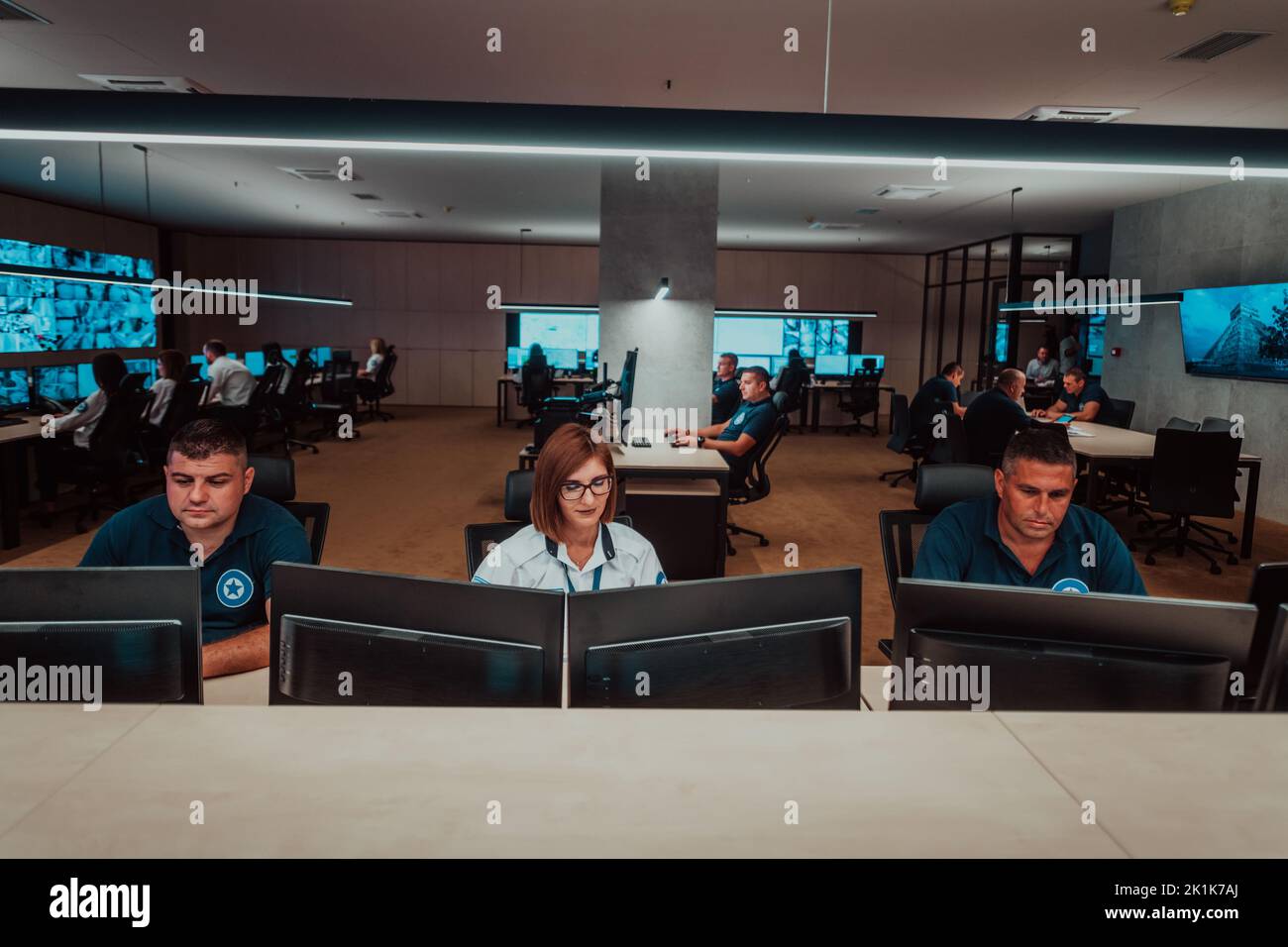 Group of Security data center operators working in a CCTV monitoring ...