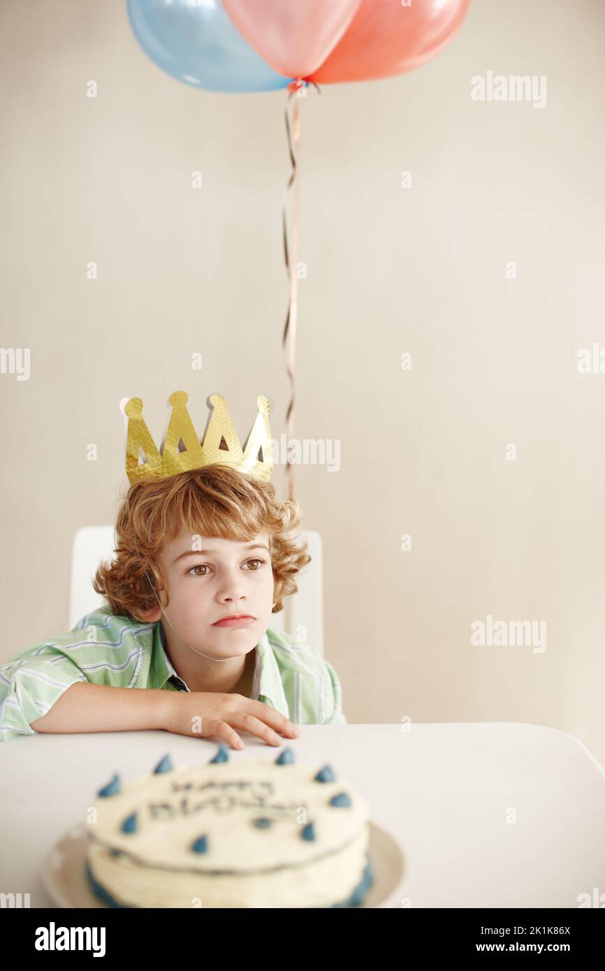 What if I dont want to grow up. a cute little boy looking unhappy while ...