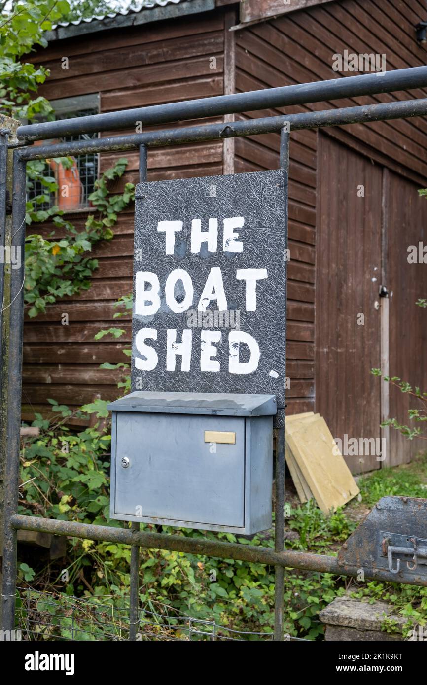 The Boat Shed sign and post box (Sept22 Stock Photo - Alamy