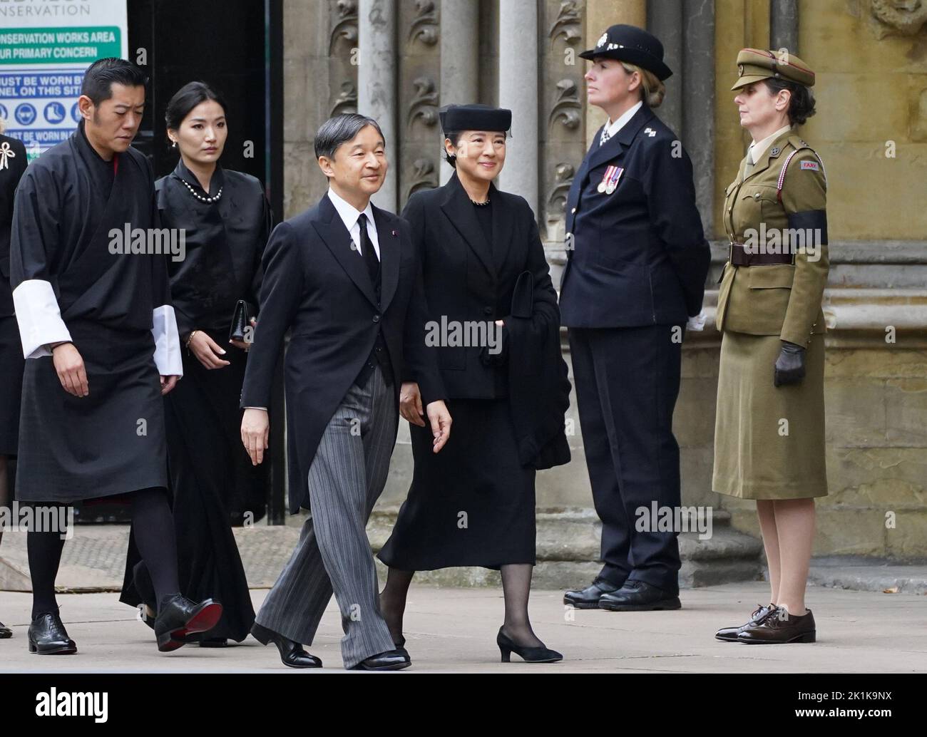 Emperor of Japan Naruhito (centre) and wife Empress Masako arrive at the State Funeral of Queen ...