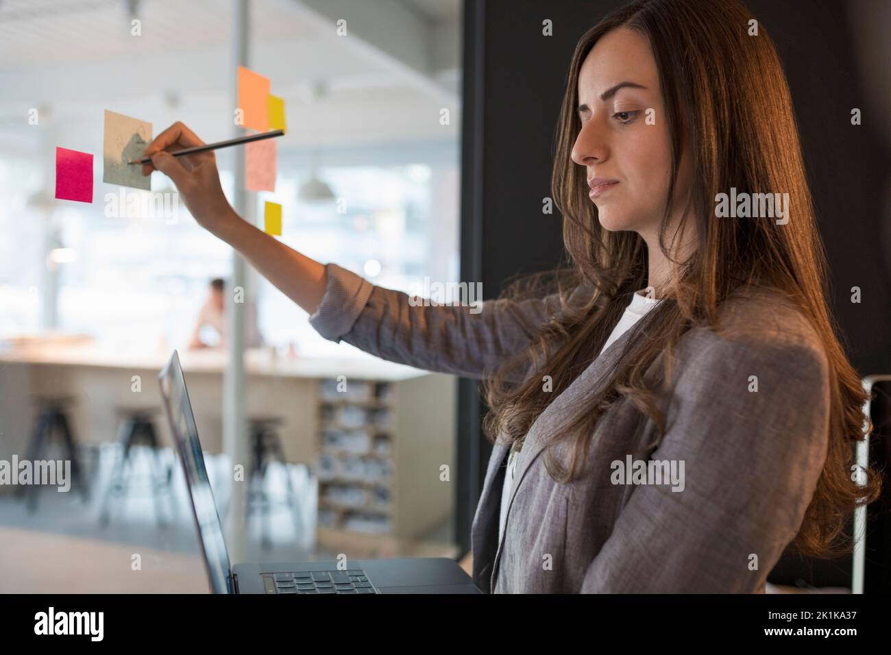 Woman focus on working post it notes hi-res stock photography and ...