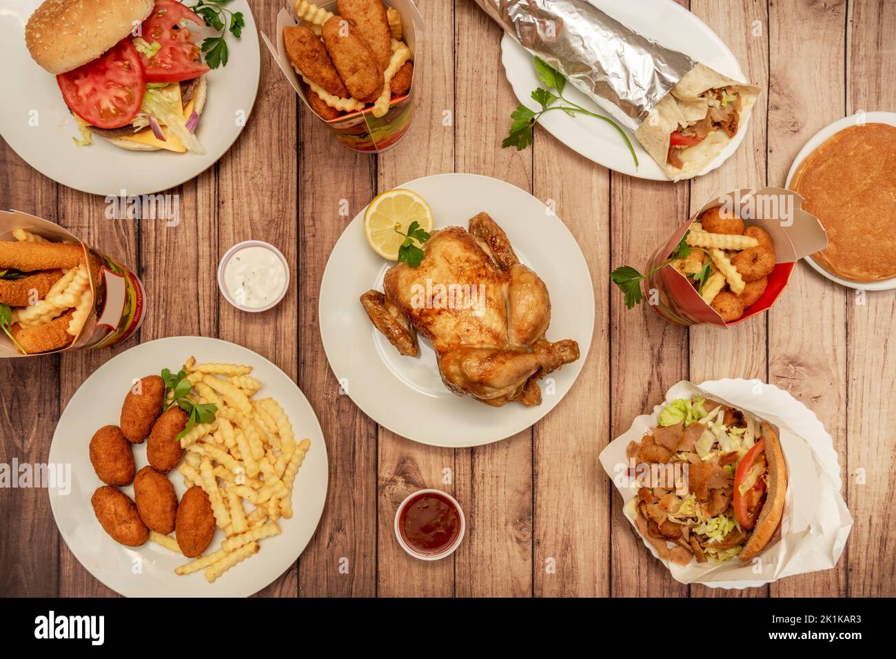 Fast food dishes, with grilled chicken, hamburgers, chicken strips ...